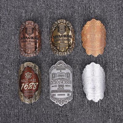 China Custom Vintage Metal Embossed Sticker Personalized Metal Plates Logo Engraving Antique Pewter Wine Bottle Label for sale