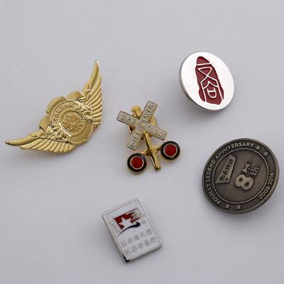 China Custom metal pin badge golden white nickel vintage gun plated for sale