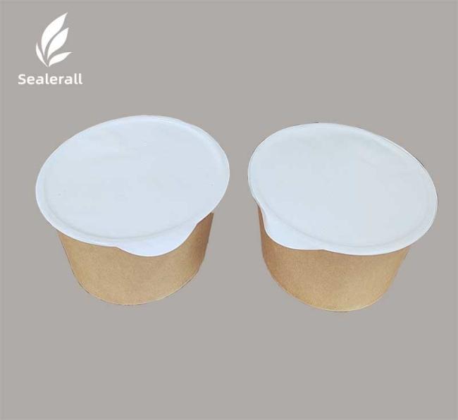 Fully automatic cup sealing machine in operation