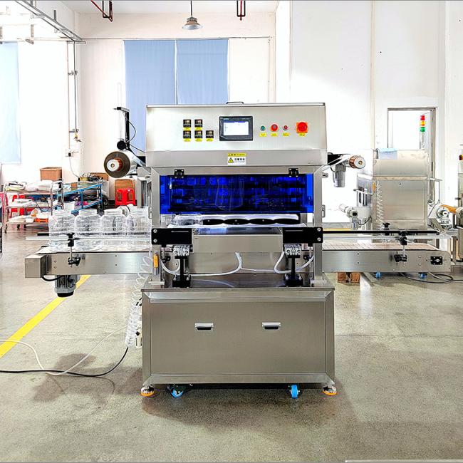 Oatmeal barrel sealing machine in operation showing full production line