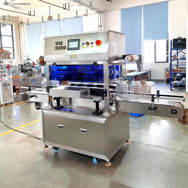 Full assembly line view of oatmeal barrel sealing system