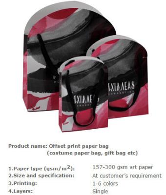 China Glossy cardboard luxury paper garment carrier bag wholesale,Medium luxury shopping paper carrier gift bag wholesale for sale