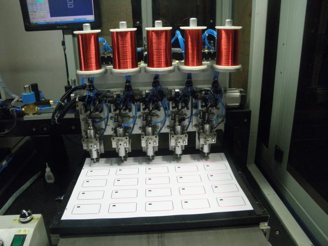 Close-up of antenna embedding process