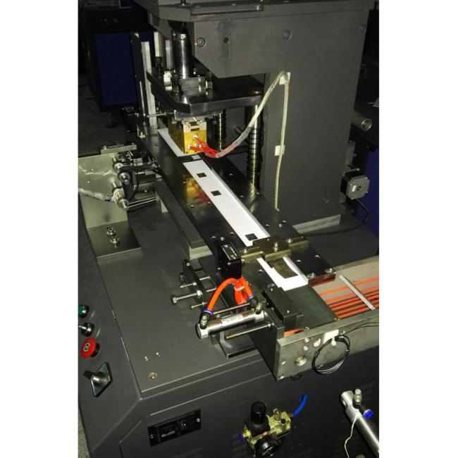 Close-up view of card stamping mechanism