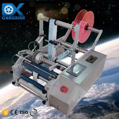 China Round Bottle Labeling Machine Beer Cans Wine Adhesive Sticker Dispenser Machine Manual Can Labeler for sale