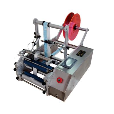 China Two Sides Stationary Dried Fruit Cans Oliver Oil Glass Manual Round Bottle Labeling Machine for sale