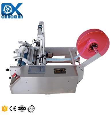 China Semi Automatic Round Products Plastic Container Bottle Jar Can Wine Hand Labelling Machine Price for sale