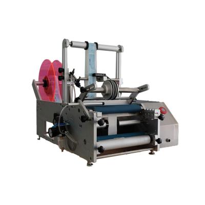 China Stick Sticker Portable 2 Sides Wrap Around For Pure Water Round Beer Bottles Hand Labelling Machine for sale