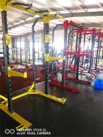 China Half Cage Bench Press Smith Machine Multifunctional Gym Rack with Dumbbell Function for sale