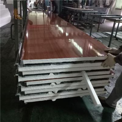 China EPS sandwich roof panel 1050-75-0.426mm sandstone steel sheet up and wood grain down for sale