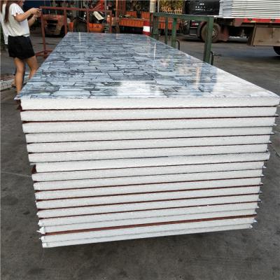 China EPS sandwich wall panel 1150-50-0.426mm sandstone steel sheet up and wood grain down for sale