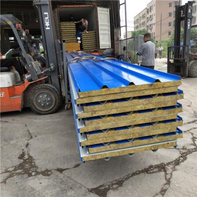 China fireproof 50mm rock wool roof sandwich panel 960-50-0.376mm blue steel sheet up for sale