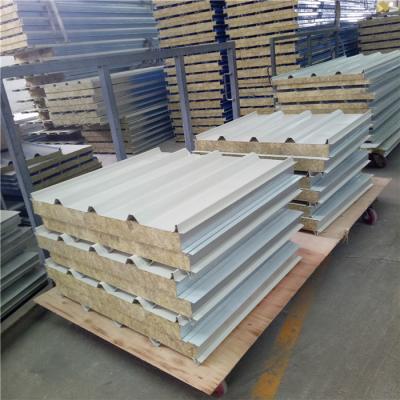China 960mm building panels 50mm fireproof rock wool sandwich roof board with steel strip for sale