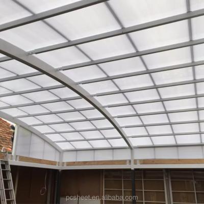 China Plant Greenhouse for Office Building Polycarbonate Home Indoor Foldable Kit Aluminium Frame Garden Backyard Greenhouse for sale