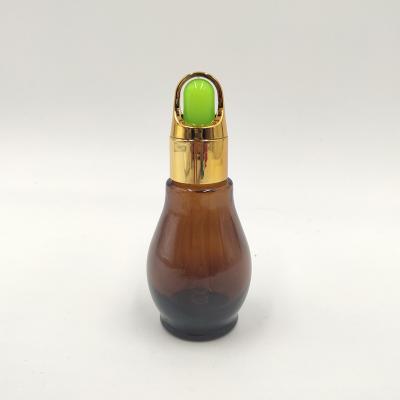 China 30ml Essential Oil Packaging Amber Color Glass Dropper Bottle with Golden Cap for sale