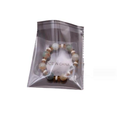 China 10*10CM Explosion-proof Edge Transparent Paper Self-adhesive Shrink Bags Black Gravure Printing Bag Recyclable for sale