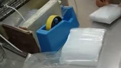 Transparent frosted adhesive pouch with tight bone strips for repeated sealing