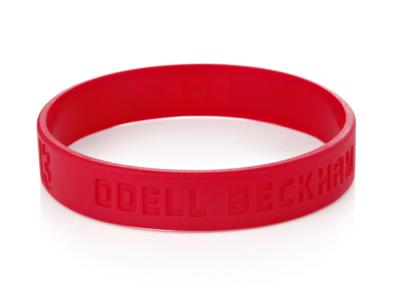 China Enseñe los logotipos debossed las pulseras de goma y el precio modificado para requisitos particulares los colores buenos en venta