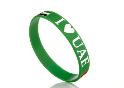 China debossed and painted silicone bracelet ,red bracelet ,black text logo en venta