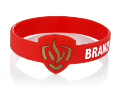 China El color de goma Fundraising de las pulseras llenó color rojo de la forma de encargo en venta