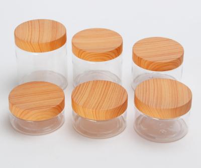 China Berijpte Kosmetische Ronde Acrylkruiken met Bamboedeksels 7g-10g Te koop