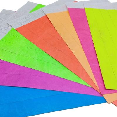 China Make a Statement at Festivals with Our Neon Paper Tyvek Wristband in Various Colors for sale