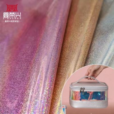 China Pu Holographic Leather Little Grain Embossed Synthetic Artificial Faux Shoes Vanity Case Handbag Notebook Leather Fabric for sale