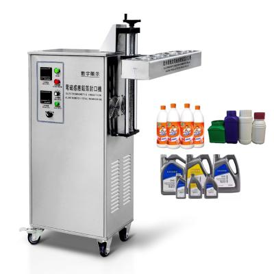 China Automatic Electromagnetic induction aluminum foil sealing machine for sale