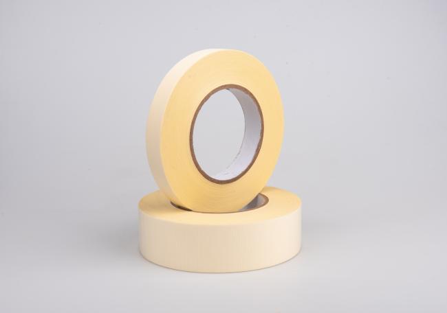 White acetate cloth tape roll showing adhesive side