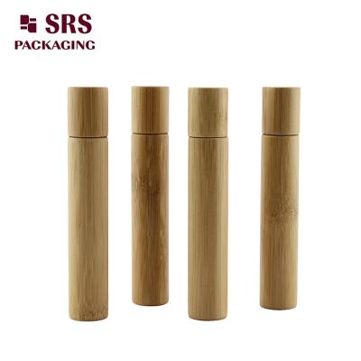 China 15ml real bamboo roller olive oil glass bottle no leakage good massage perfume bottle factory for sale