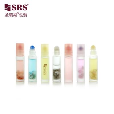 China 10ml Molded Glass Roll‑on Bottle Empty Essential Oil Roller Bottle Fitted With Gemstone Chips Cosmetic OEM Custom Logo for sale