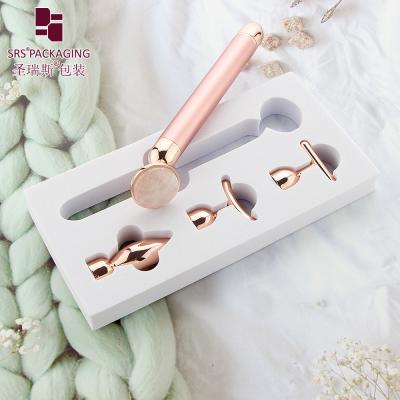 Cina imballaggio cosmetico di lusso giada massaggio testa vibratore elettrico beauty bar in vendita