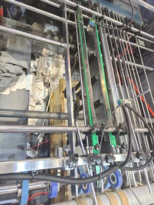 China JIGUO TC-1250Q Vollservo-Intelligente Eckenschneide- und Linienpress-Fenstermaschine, Folienblattdicke (mm): 0,03-0,3 mm, V-Schnitt Max. Arbeitsgeschwindigkeit: 15000+ Stk./h (Eckenschneide- und Rillarbeiten) zu verkaufen