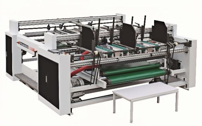 Double-sheet folder-gluer machine in operation