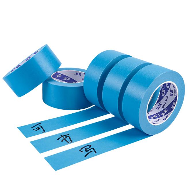 Green washi masking tape roll showing adhesive side
