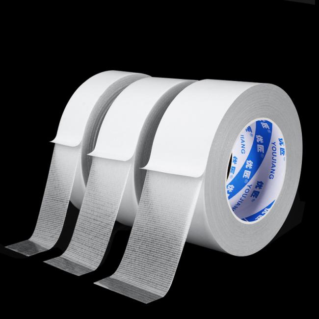 Double sided duct tape roll showing adhesive sides