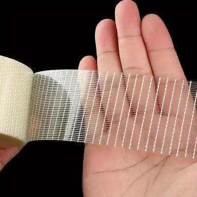 China Cross Fiber Fiberglass Reinforced Packing Tape With Rubber Adhesive And Fiberglass Mesh for sale