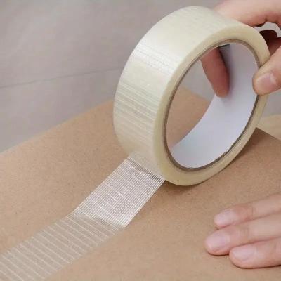 China Cross Fiber Fiberglass Reinforced Packing Tape With Rubber Adhesive And Fiberglass Mesh for sale