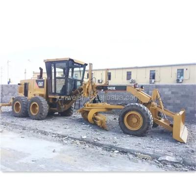 China 18000 kg Motor Detuz usado Caterpillar Motor Grader CAT 140K 140H com balde de lâmina dianteira à venda