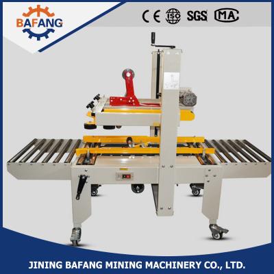 China FXJ-6050 top & bottom drive strapping machine, Semi -automatic Cartons taping machine for sale