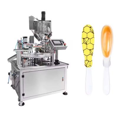 China Npack Automatic Honey Spoon Filler Machine For Liquid Filling And Packaging Of Ketchup for sale