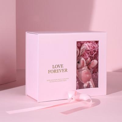 China As cores feitas sob encomenda embalam horizontalmente a caixa de presente de papel cor-de-rosa magnética com fita à venda