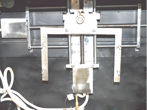 Specimen holder for flammability tester