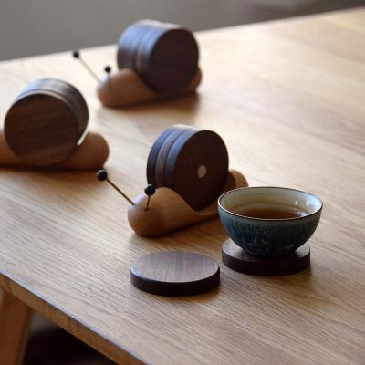 Cina Cartone animato Cussone per tazze di lumaca di noce nera Cussone da tè in legno per isolamento e decorazione in vendita