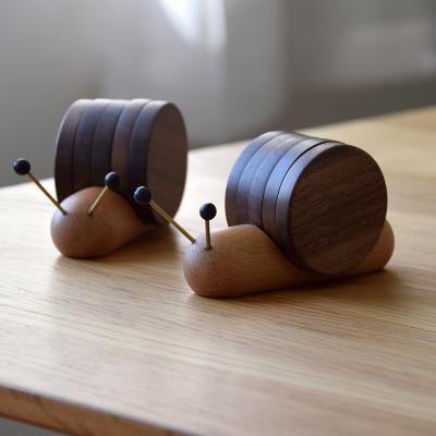 Cina Cartone animato Cussone per tazze di lumaca di noce nera Cussone da tè in legno per isolamento e decorazione in vendita