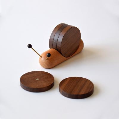 Cina Cartone animato Cussone per tazze di lumaca di noce nera Cussone da tè in legno per isolamento e decorazione in vendita