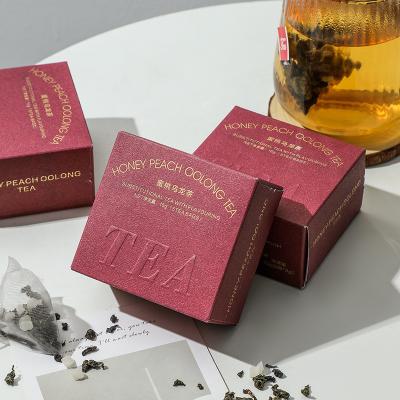 Cina Relazioni con gli ex studenti Tè regalo Pesco Oolong Tè in imballaggio stampato a caldo Attività 8 marzo in vendita