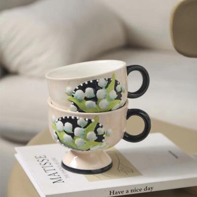 Cina Agenzia di viaggio Essentials Verniciato a mano Liri della valle Tazza di caffè in ceramica dalla Finlandia in vendita