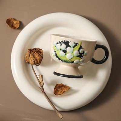 Cina Agenzia di viaggio Essentials Verniciato a mano Liri della valle Tazza di caffè in ceramica dalla Finlandia in vendita