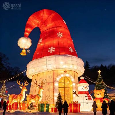 China Custom LED Giant Santa Hat House Lantern Set, Outdoor Christmas Light Sculpture with Reindeer, Snowman & Bear, Support Customization for sale
